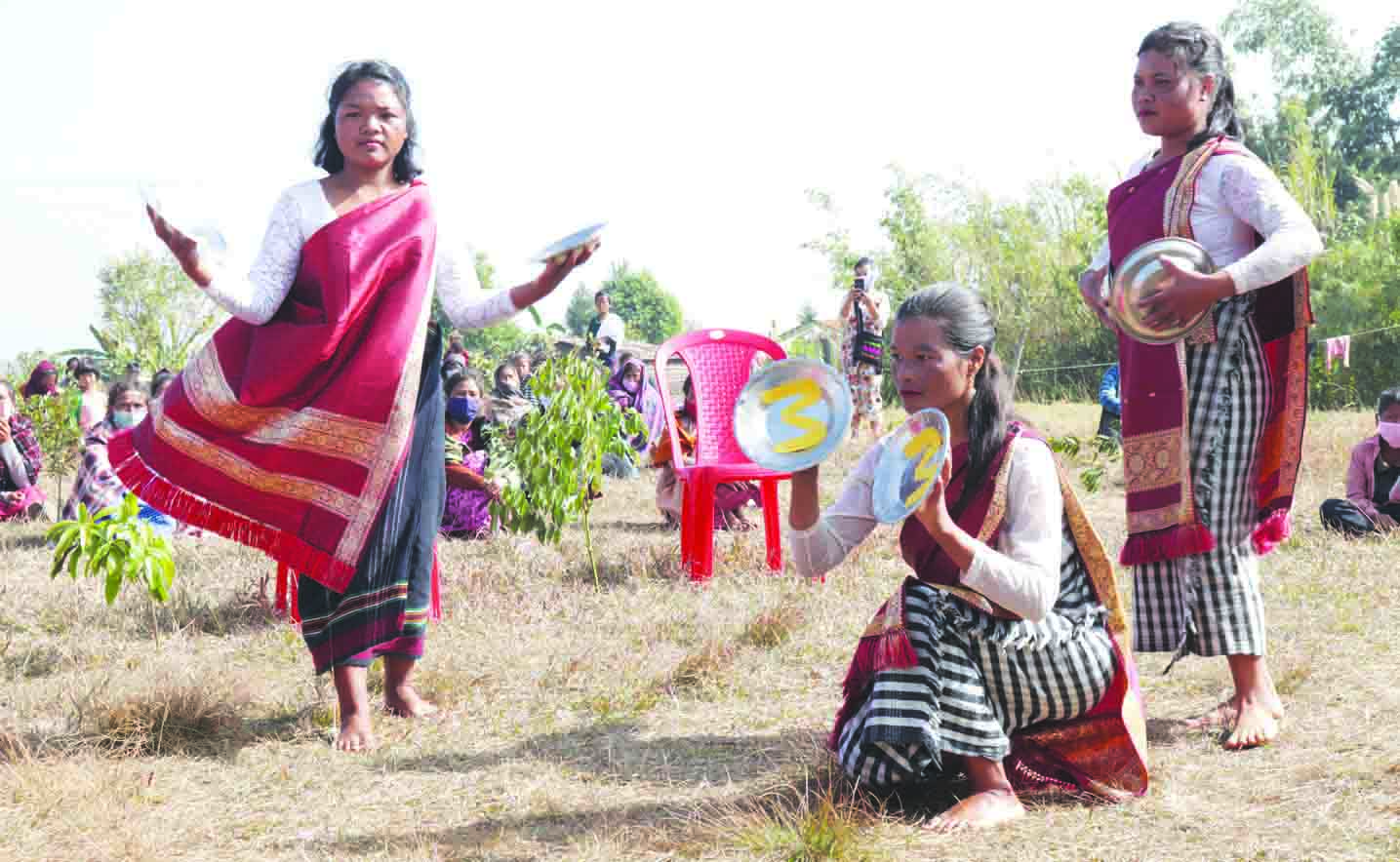 Women perform a traditional dance during the Community Seed Fair ...
